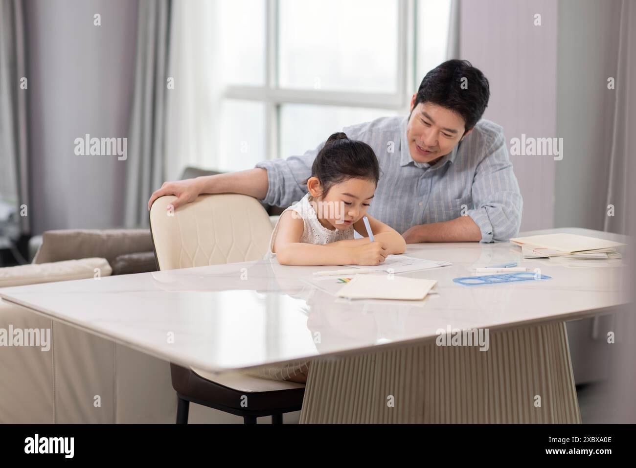 Dad Helping Daughter With Her Homework Stock Photo - Alamy