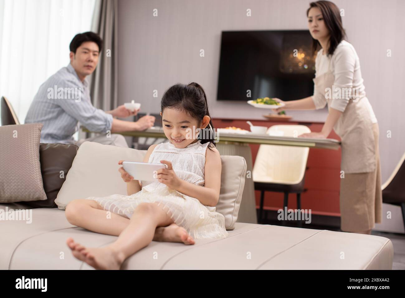 Girl Being Addicted To Mobile Games Stock Photo - Alamy