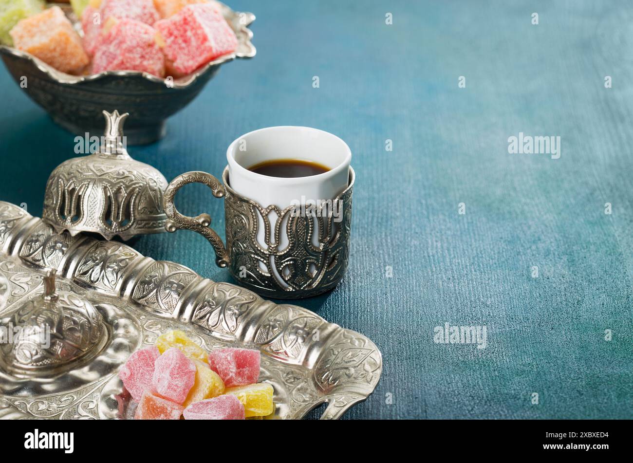 Traditional turkish coffee and turkish delight on blue-green wooden ...