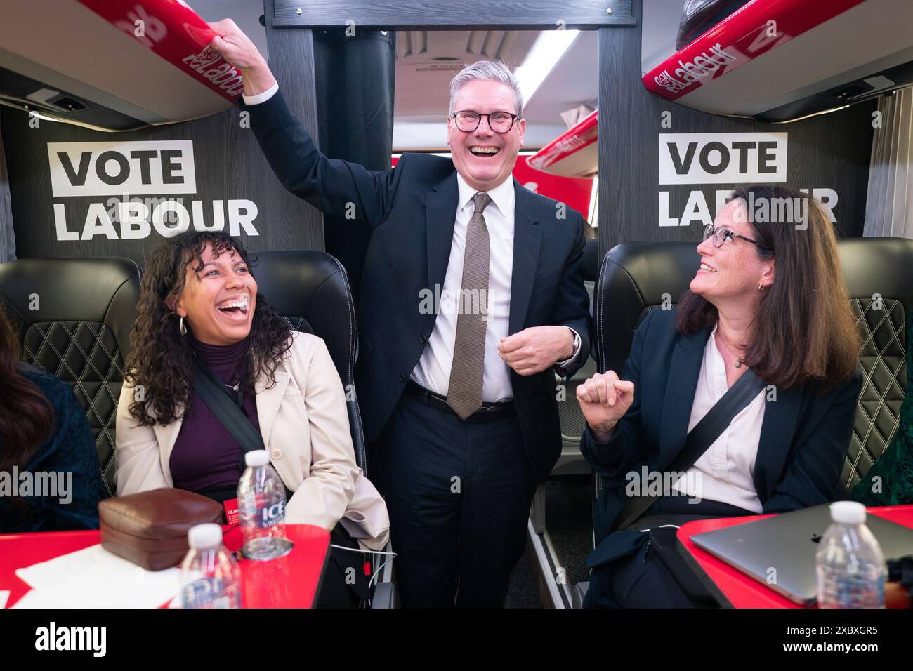 Labour Party leader Sir Keir Starmer talks to journalists on board his ...