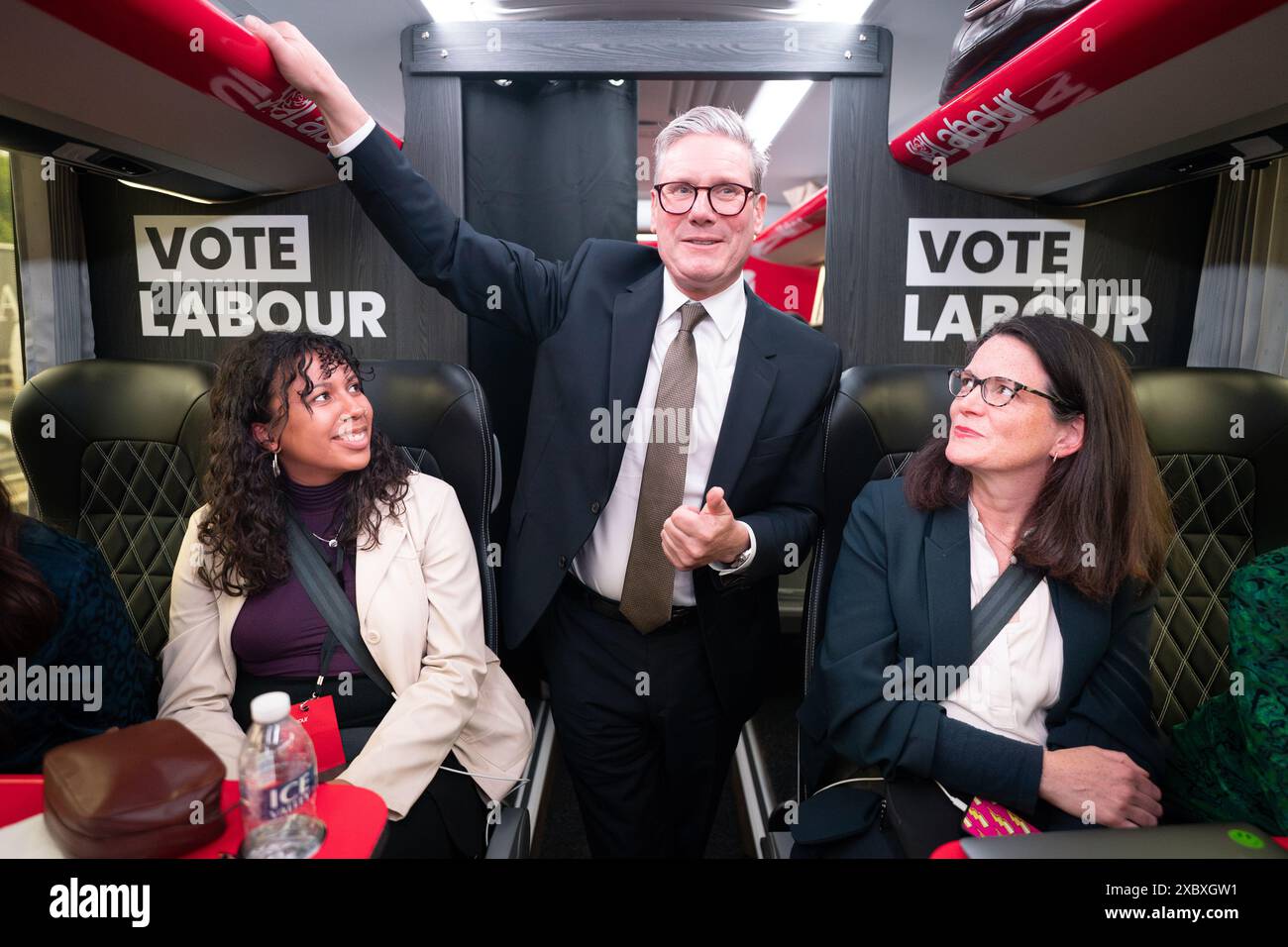 Labour Party leader Sir Keir Starmer talks to journalists on board his ...
