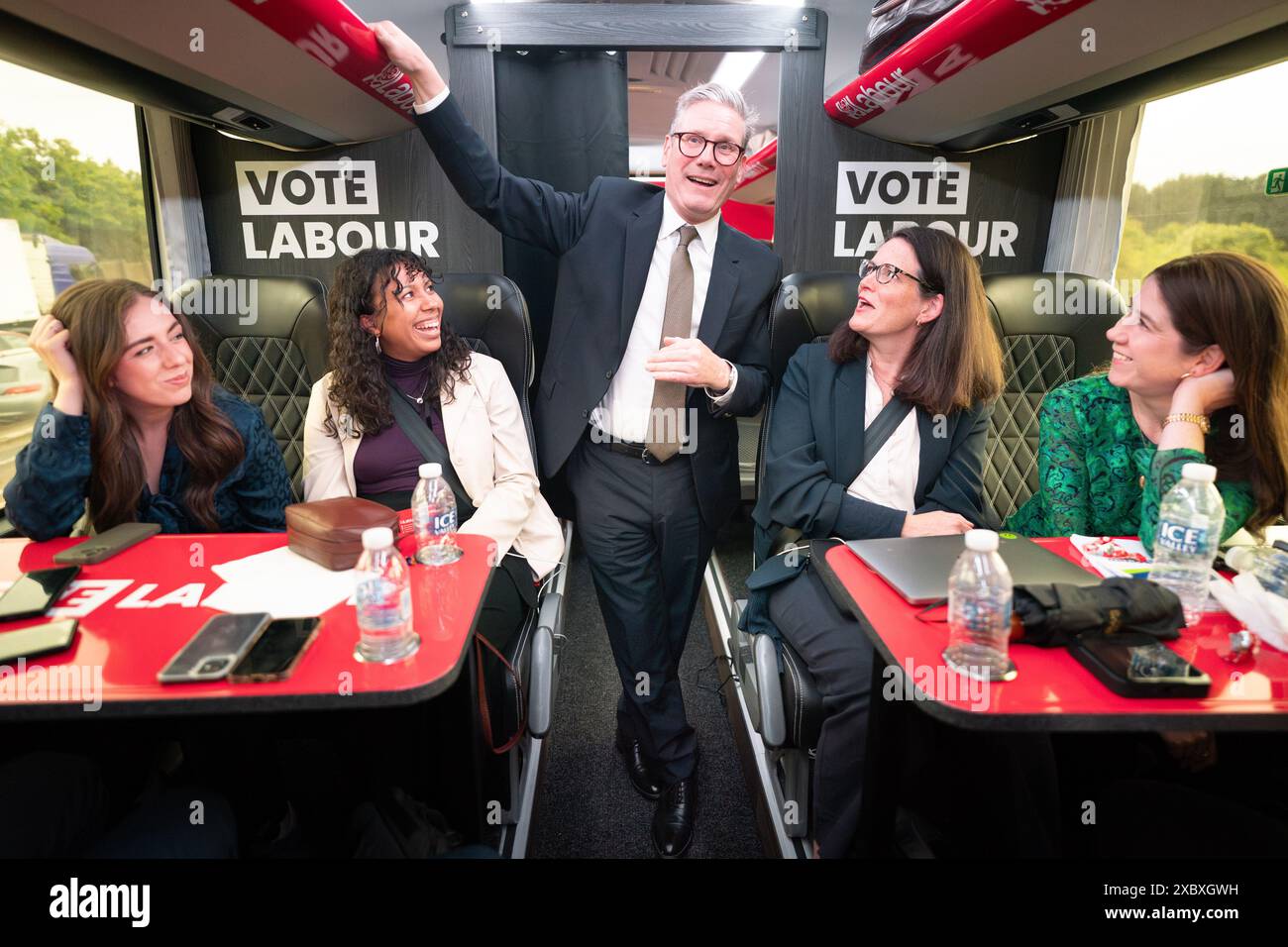 Labour Party leader Sir Keir Starmer talks to journalists on board his ...