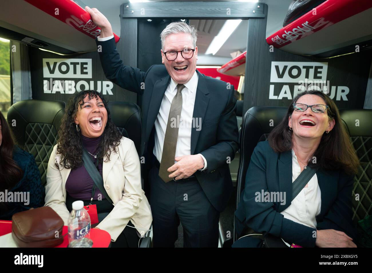 Labour Party leader Sir Keir Starmer talks to journalists on board his ...