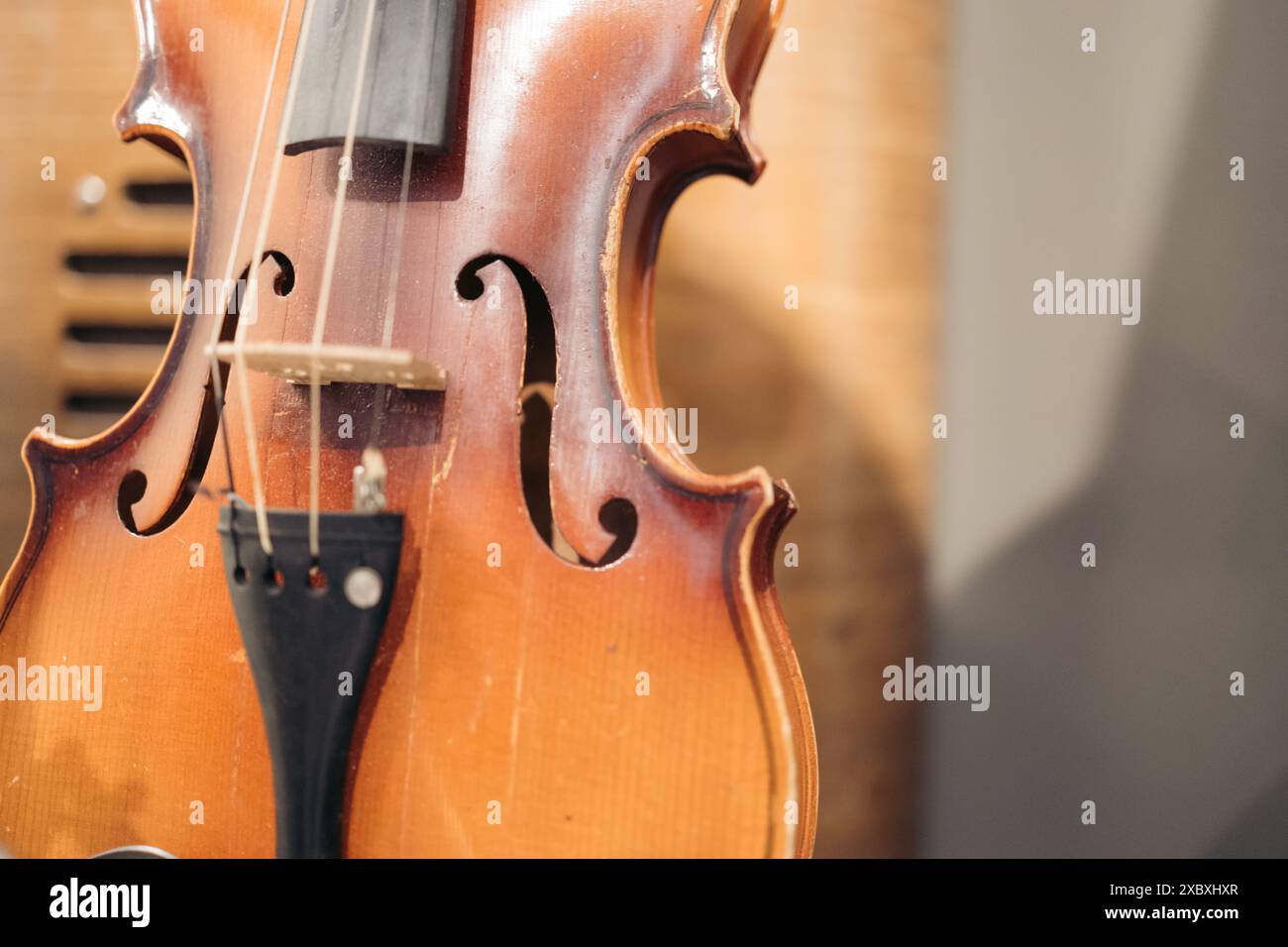 A close-up of a worn violin found in a Norwegian museum. A piece of ...