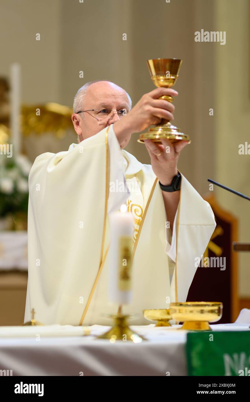 The Consecration moment of the Holy Mass Stock Photo - Alamy