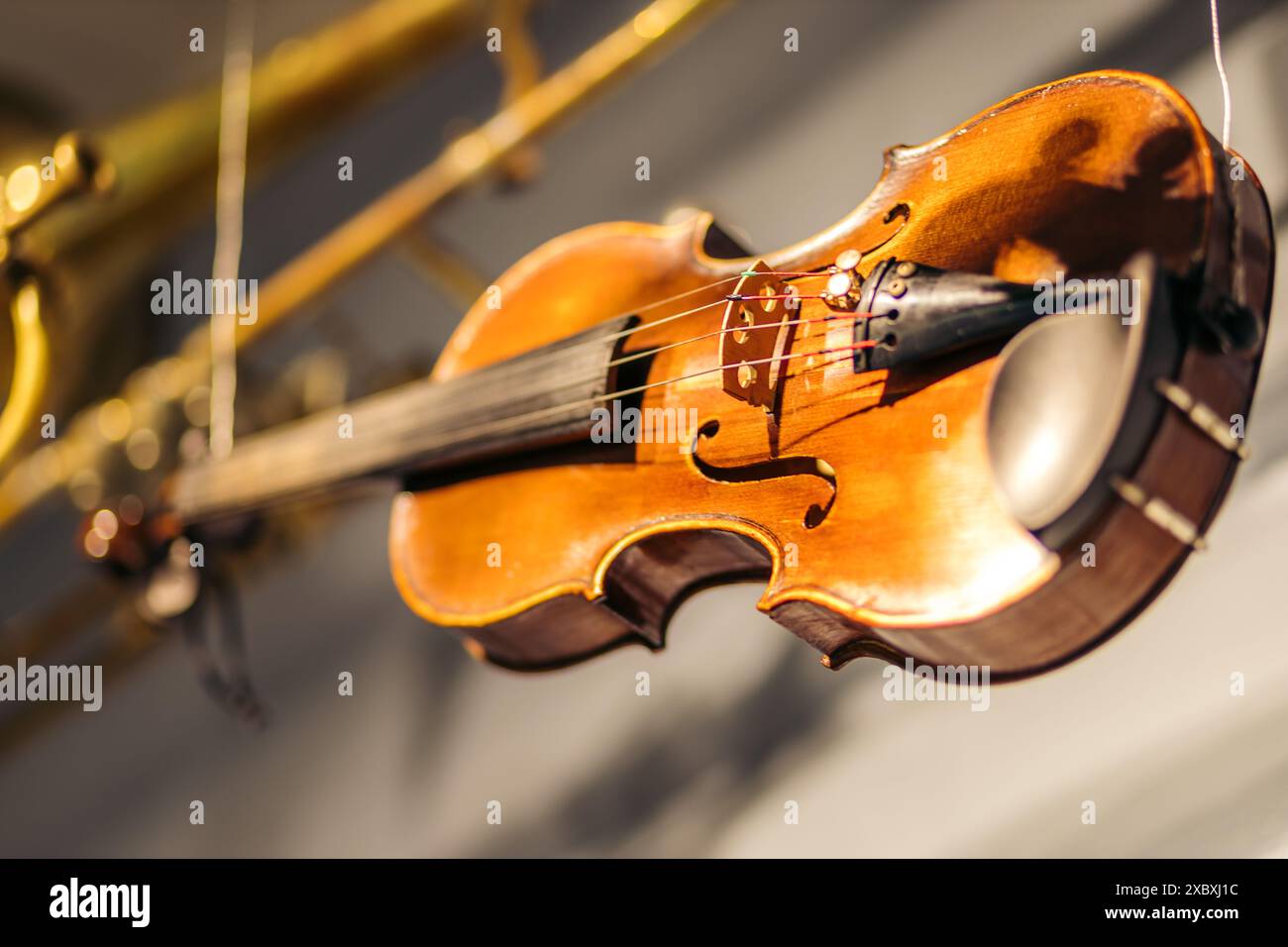 A worn violin hanging from wires in the ceiling found in a Norwegian ...