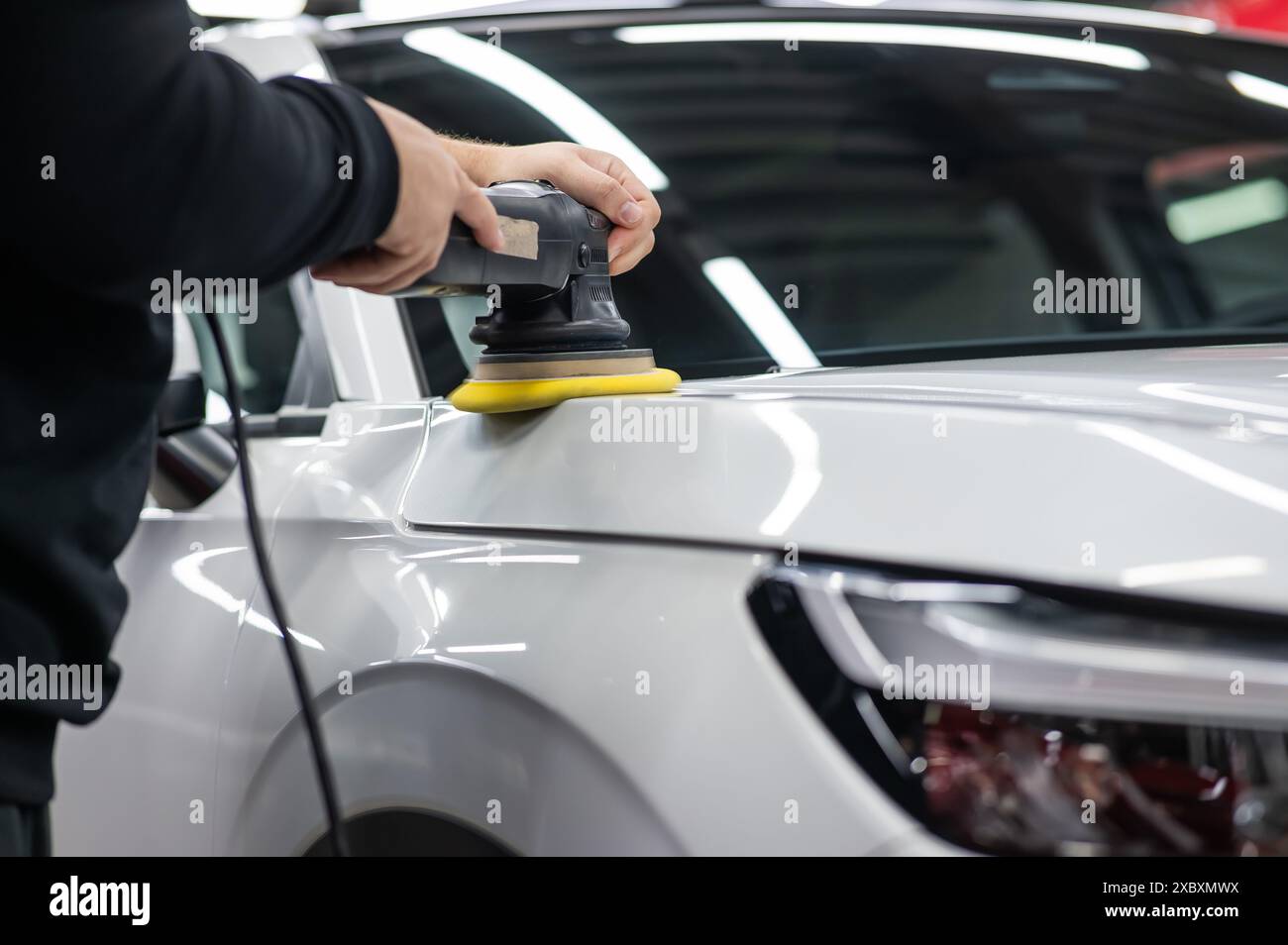 Process of polishing white car hood surface using orbital polishing ...