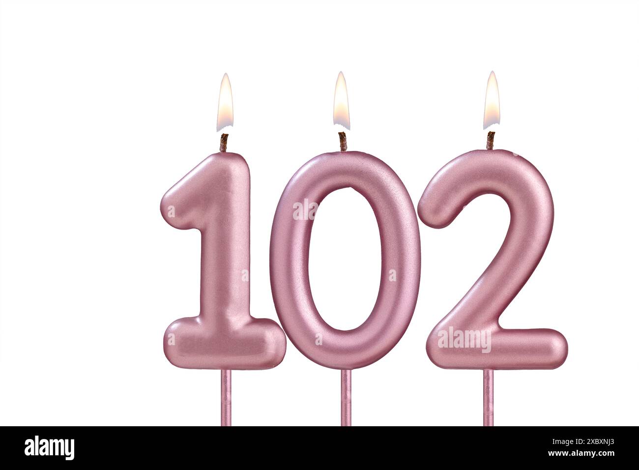 Lit birthday candle - Candle number 102 on white background Stock Photo ...