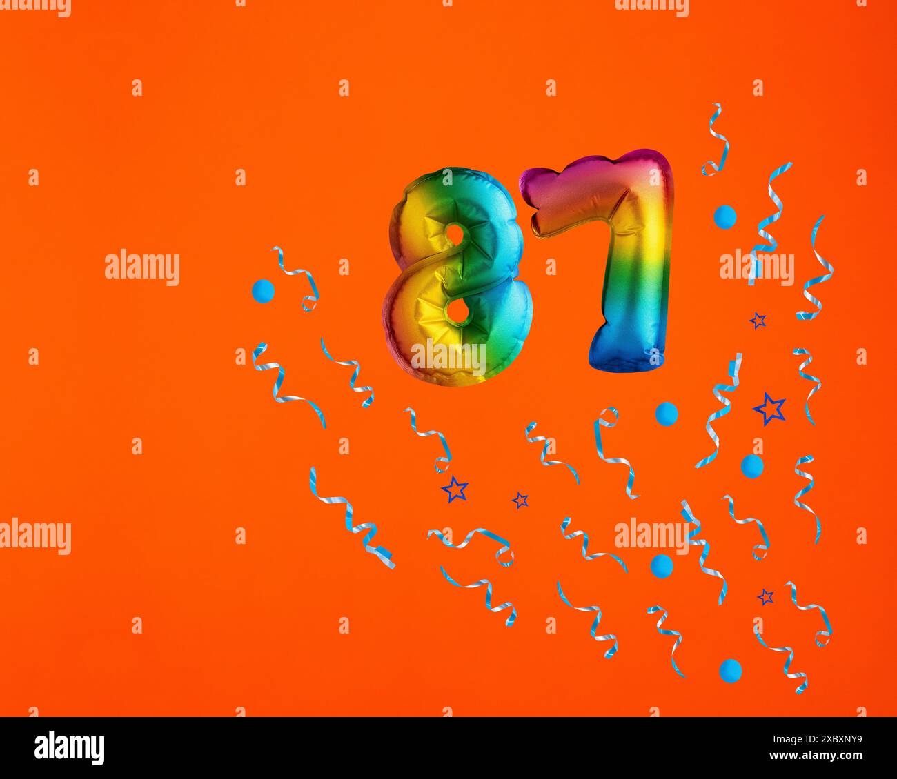 Confetti explosion with number 87 balloon - Celebration on orange ...