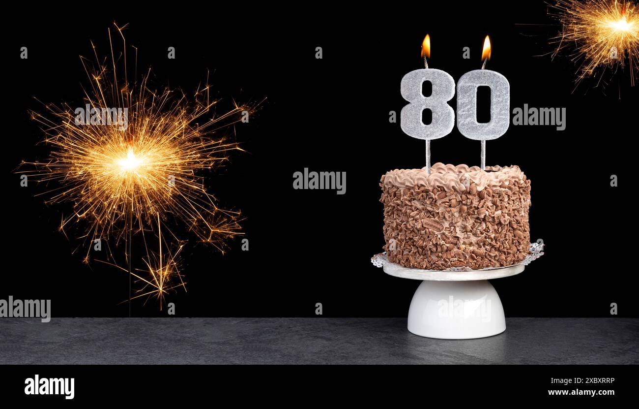 Birthday celebration with cake and candle number 80 Stock Photo - Alamy