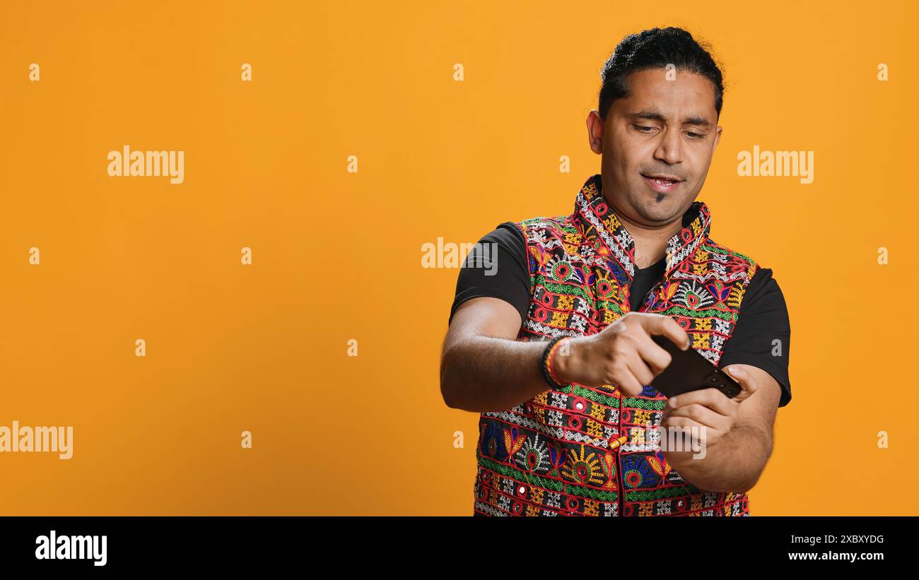 Happy indian man entertained videogames hi-res stock photography and ...