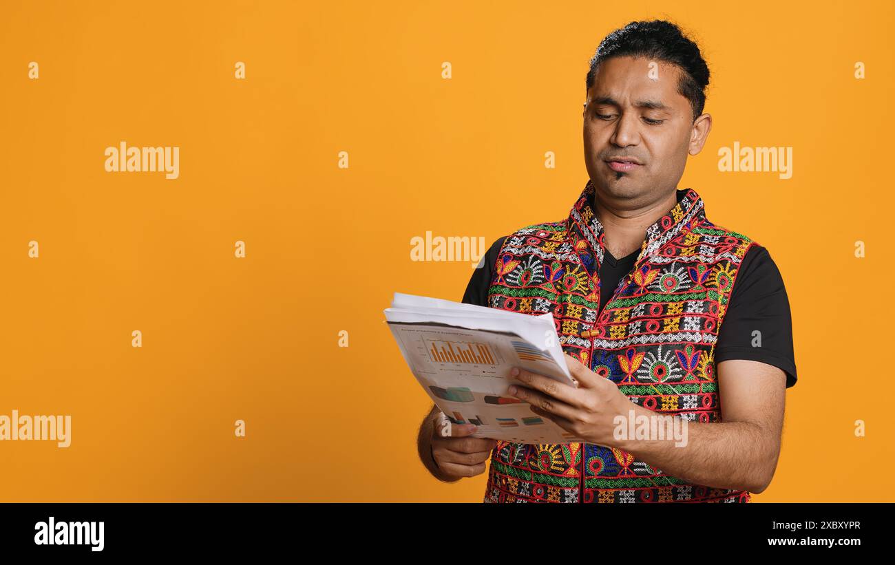 Irked manager looking over company financial profit report audit ...