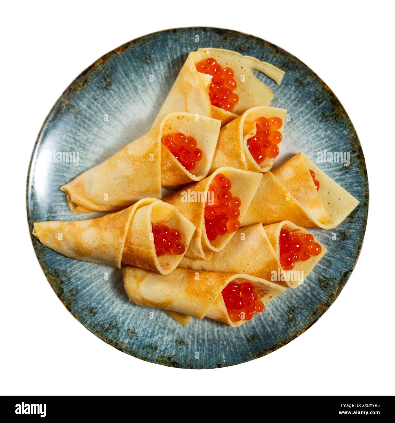 Pancakes with red caviar dished up in service plate. Traditional ...