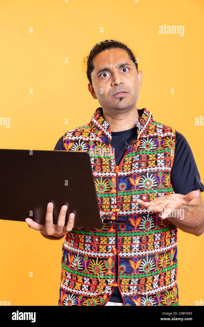 Portrait of man shocked after seeing error message on laptop screen ... Portrait of man shocked after seeing error message on laptop screen ...