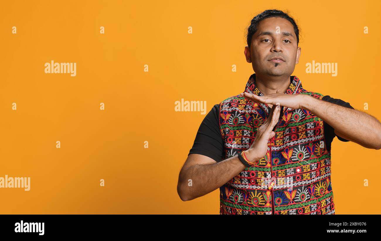 Serious man requesting timeout, doing hand gestures, unable to continue ...