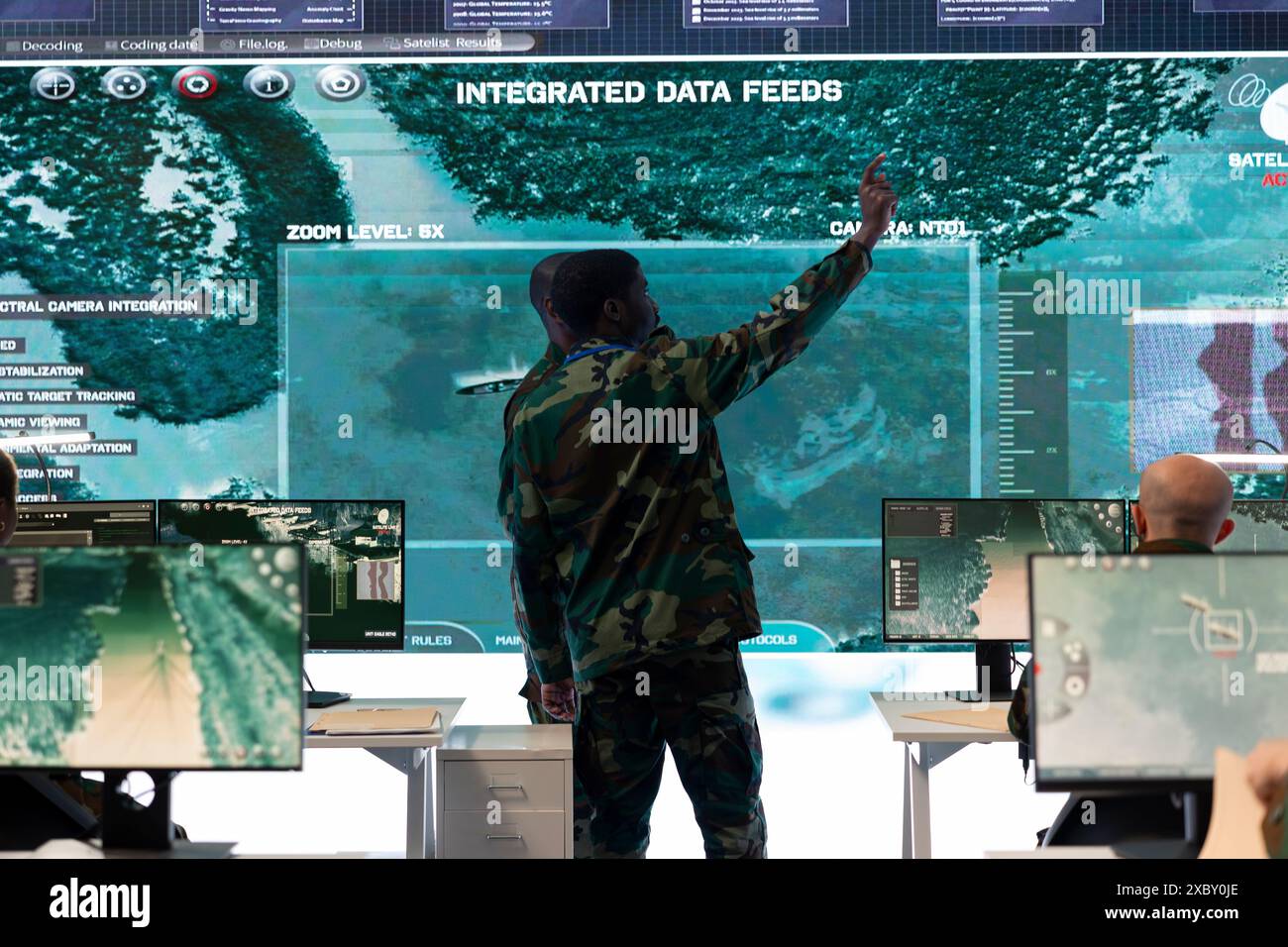 Infantry unit troopers examines satellite surveillance imagery for a ...