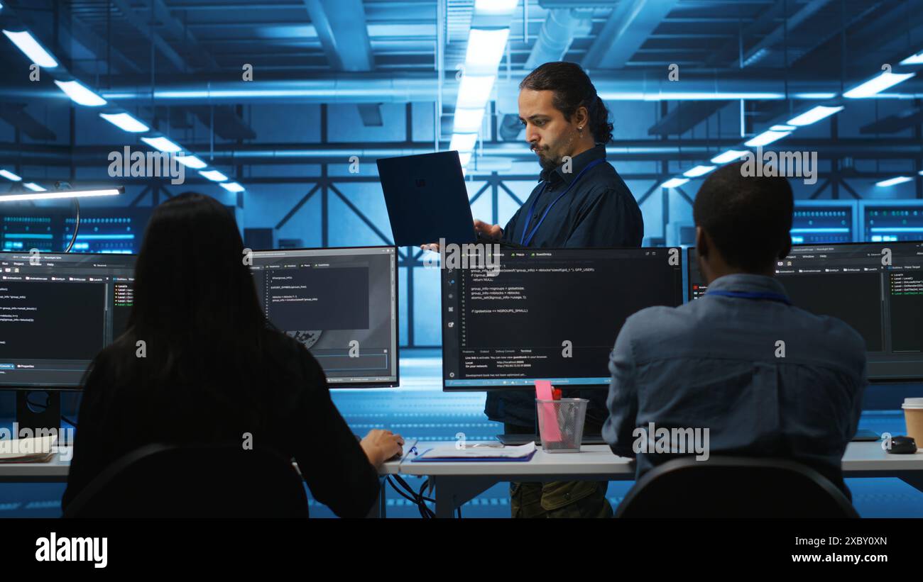 Middle eastern manager in server hub workplace doing inspection on ...