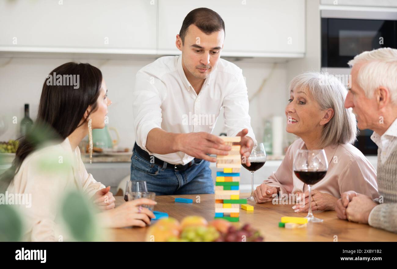 Young man son playing jenga hi-res stock photography and images - Alamy