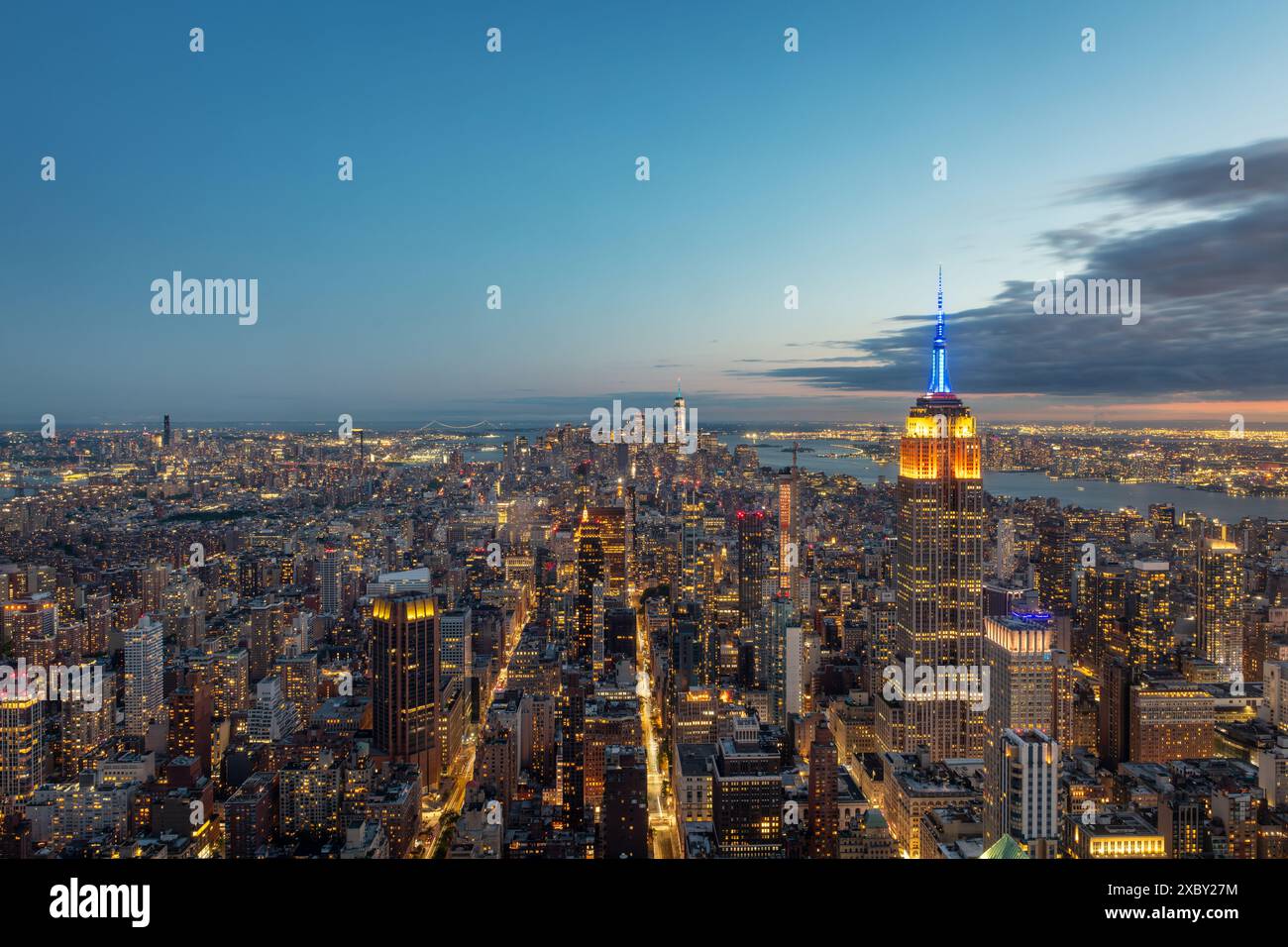 Aerial view of the Empire State Building and downtown Manhattan at dusk, New York City. This ...