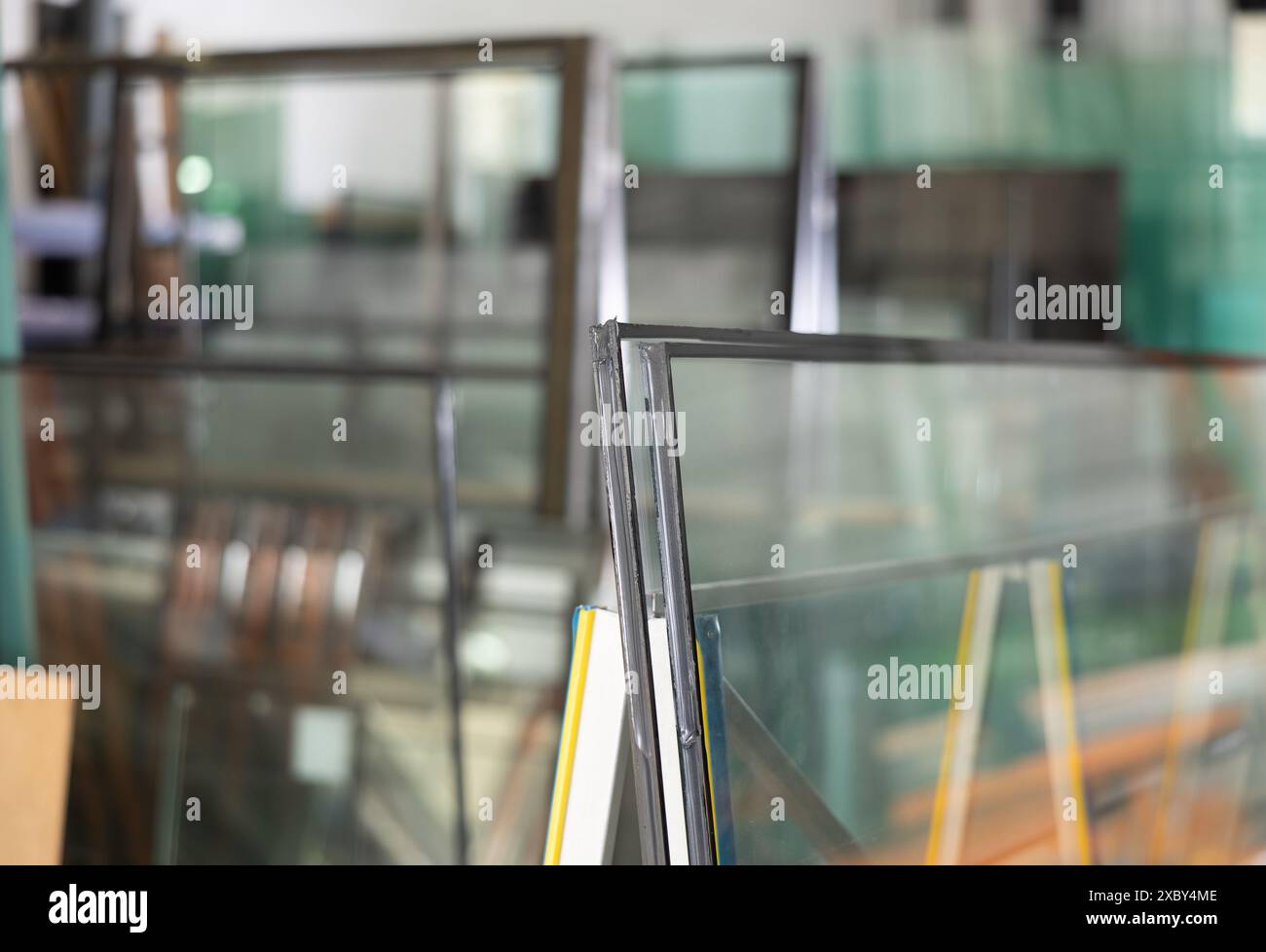 Insulated glass units stacked on support stand in workshop Stock Photo ...