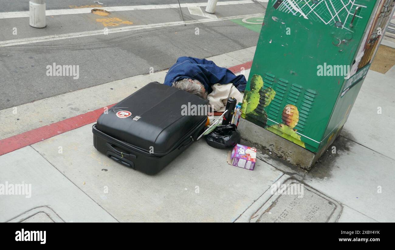 Los Angeles, California, USA 12th June 2024 Homeless man sleeping on ...