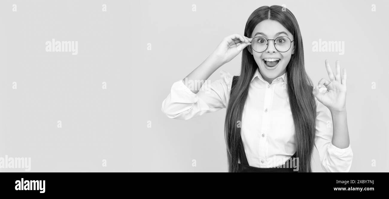 surprised kid in school uniform and glasses for vision protection ...