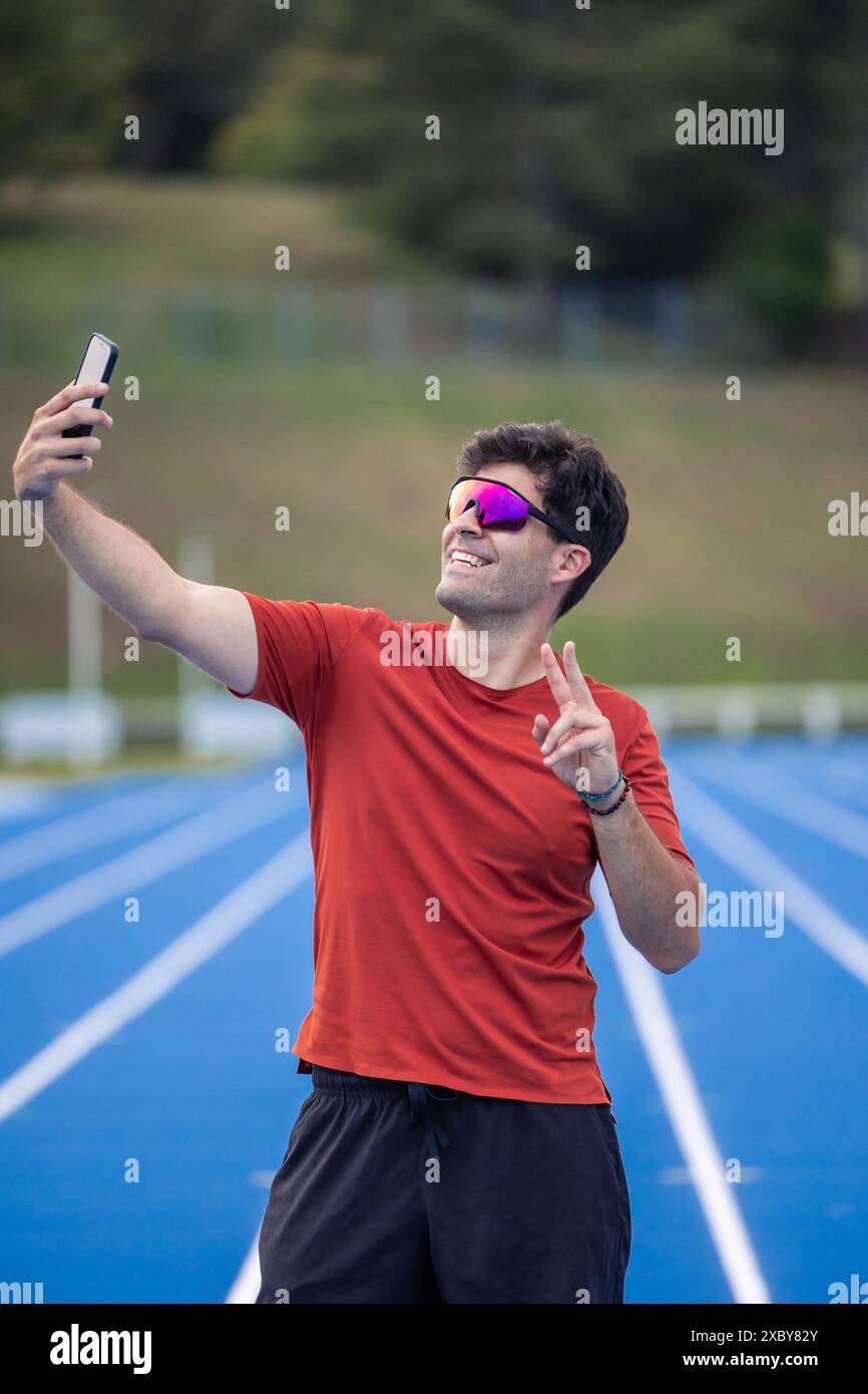 vertical dedicated runner pauses to capture a selfie moment on the ...