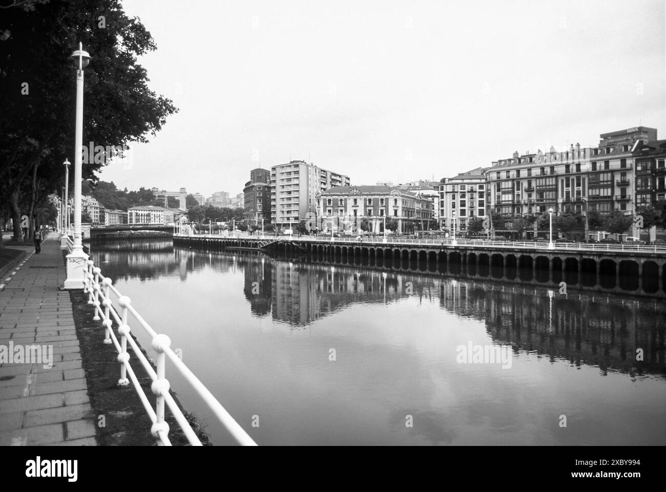 Promenade area of the River Nervion with the old city of Bilbao in the ...