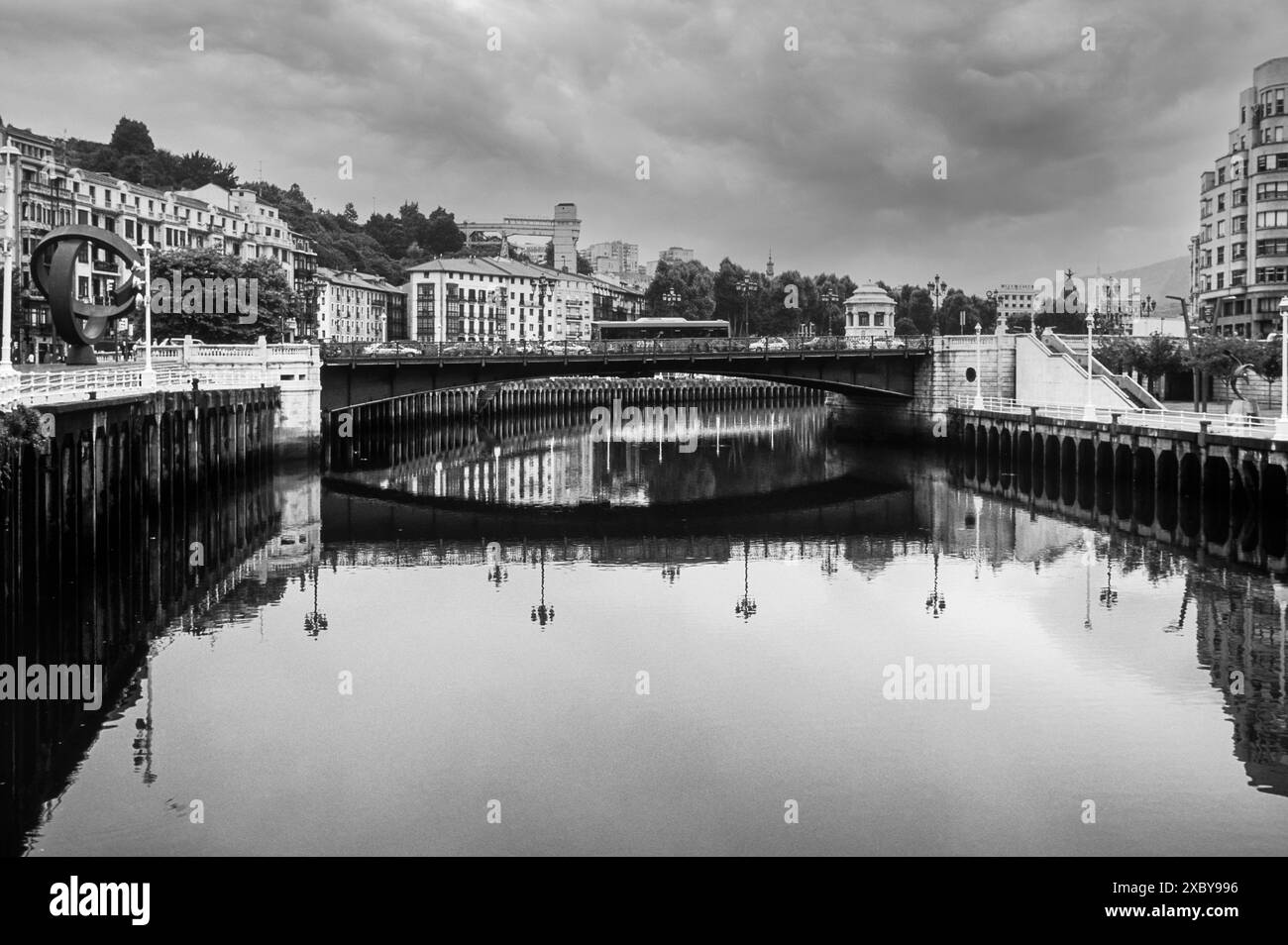 Promenade area of the River Nervion with the old city of Bilbao in the ...