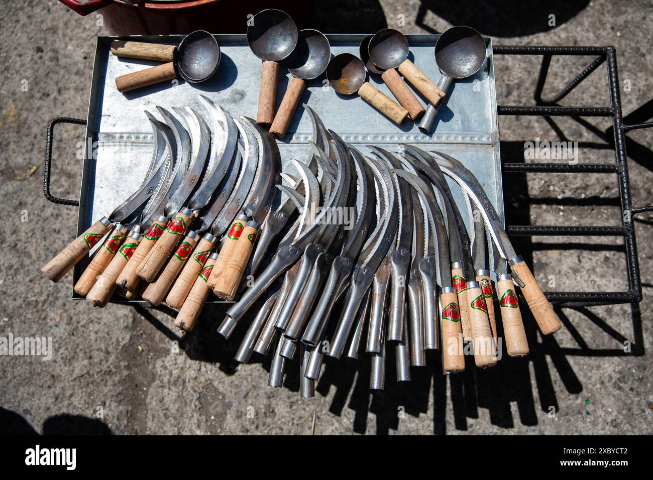 Tools, including serrated blades used for harvesting and farming at a ...