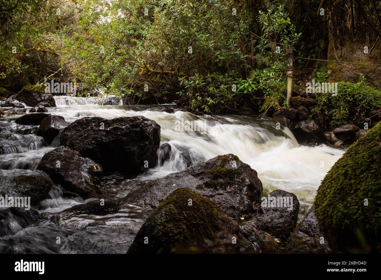 A river in long exposure flows down to the hot spring town of ...