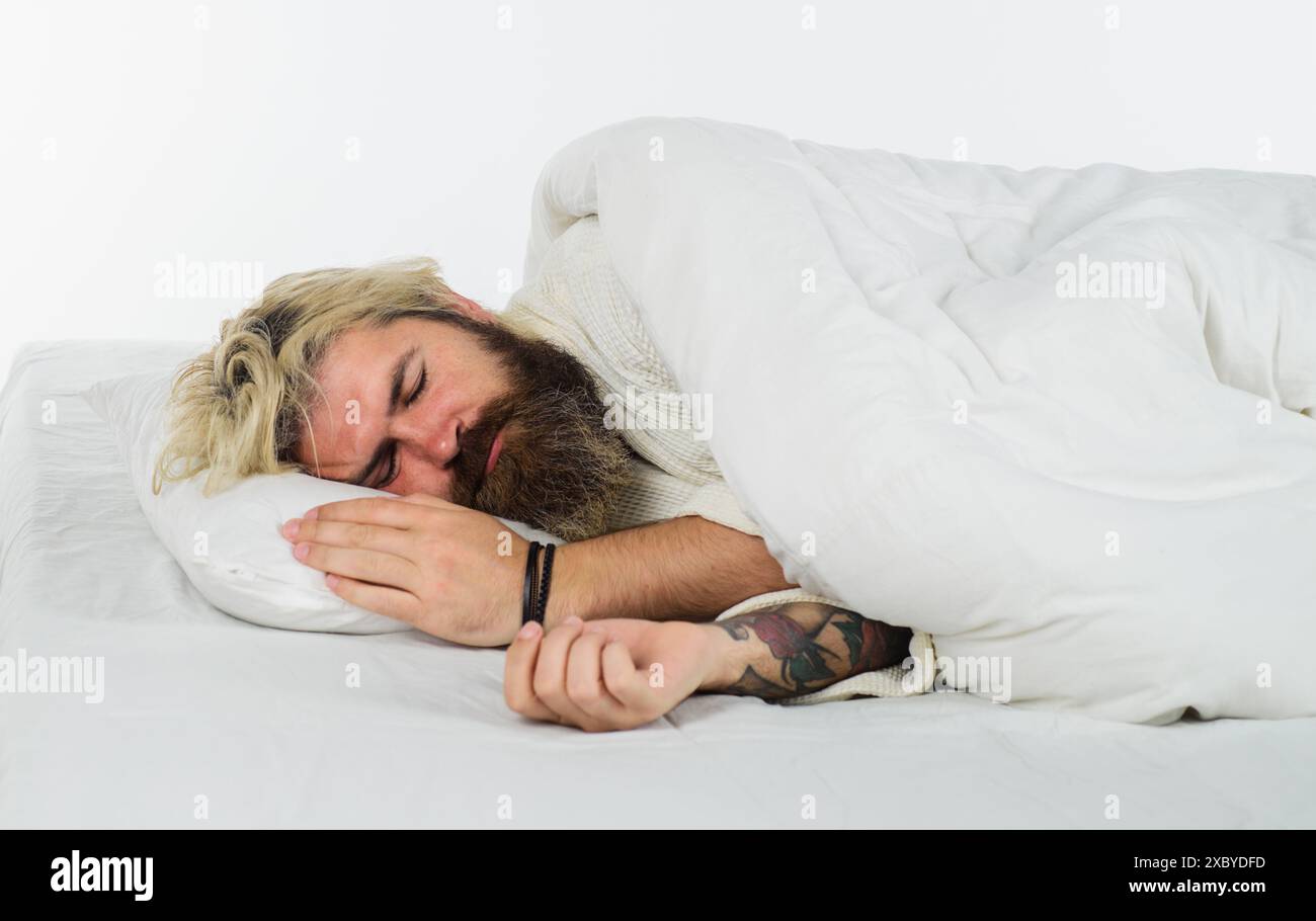 Sleeping bearded man lying in bed with closed eyes resting in bedroom ...