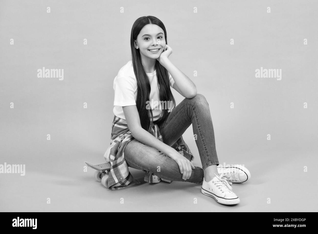 Trendy beautiful teenage model posing on blue studio background. Child ...