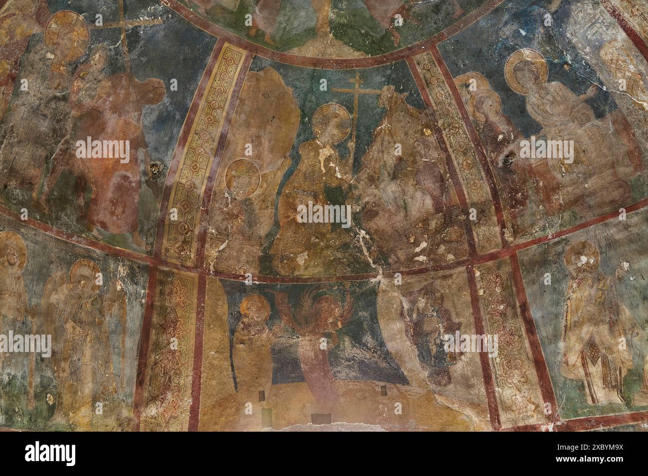 Large, weathered dome mural with numerous holy figures and religious ...