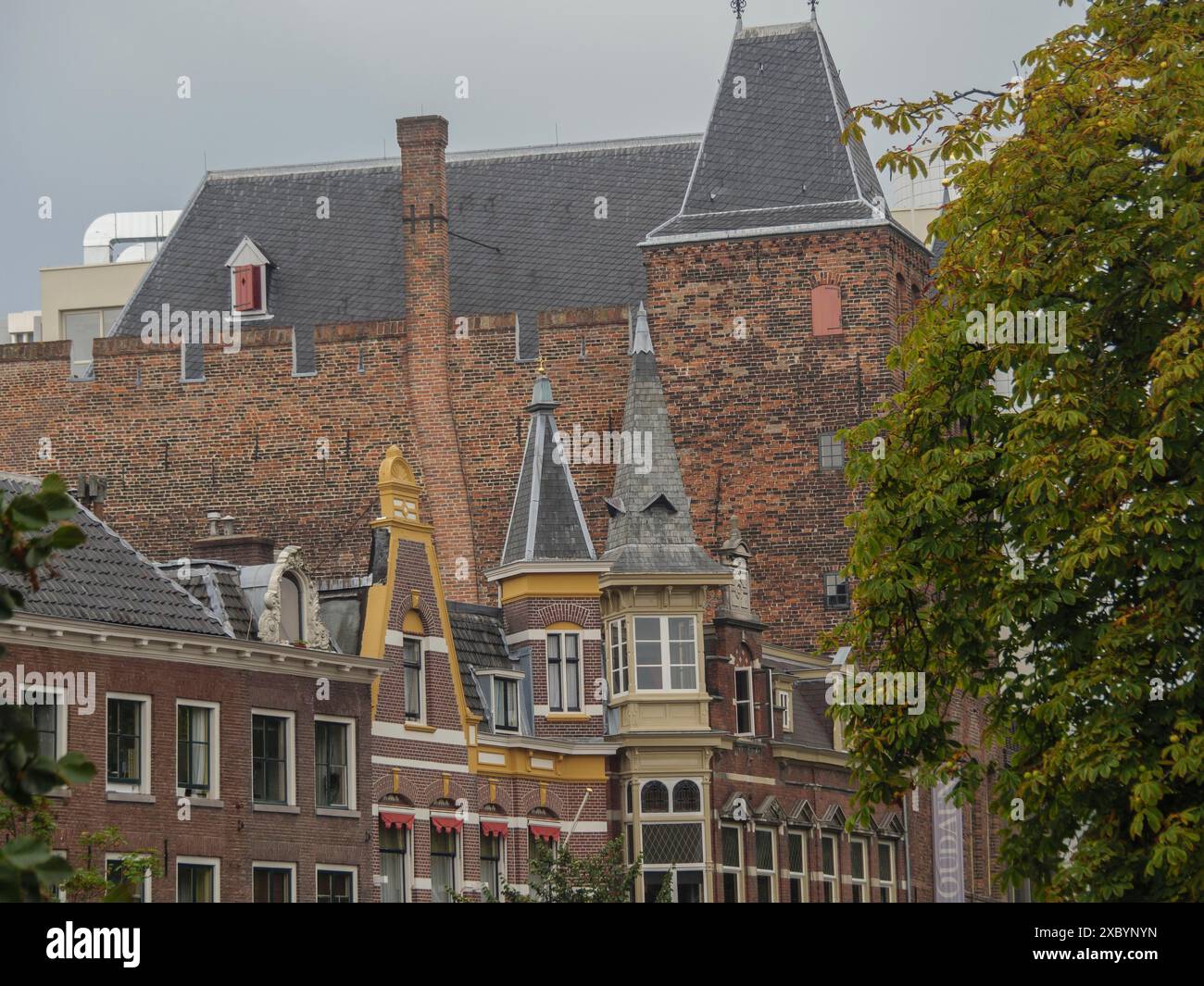A group of historic buildings with distinctive towers and brick walls ...