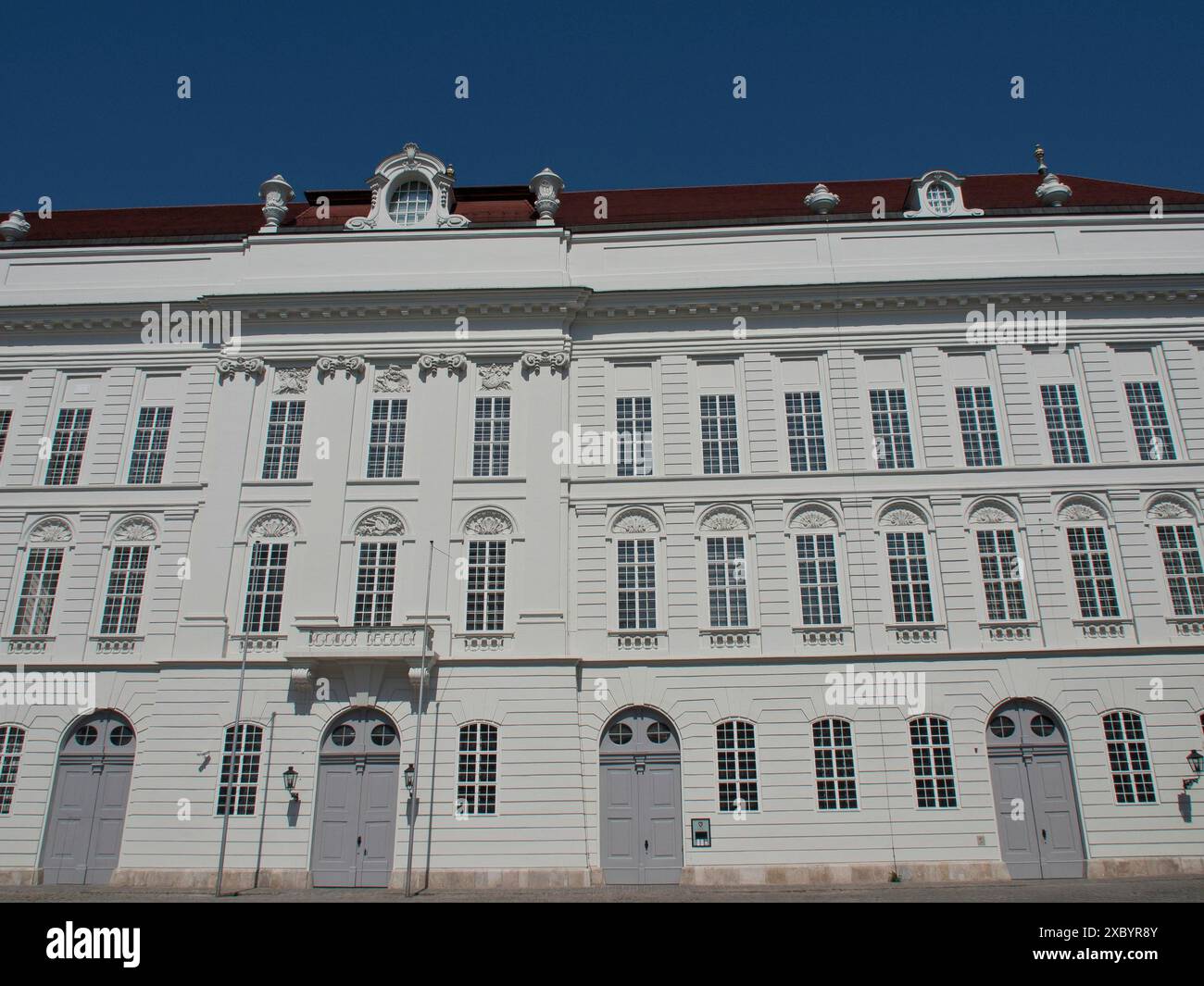 Historic building with white facade and symmetrically arranged windows ...