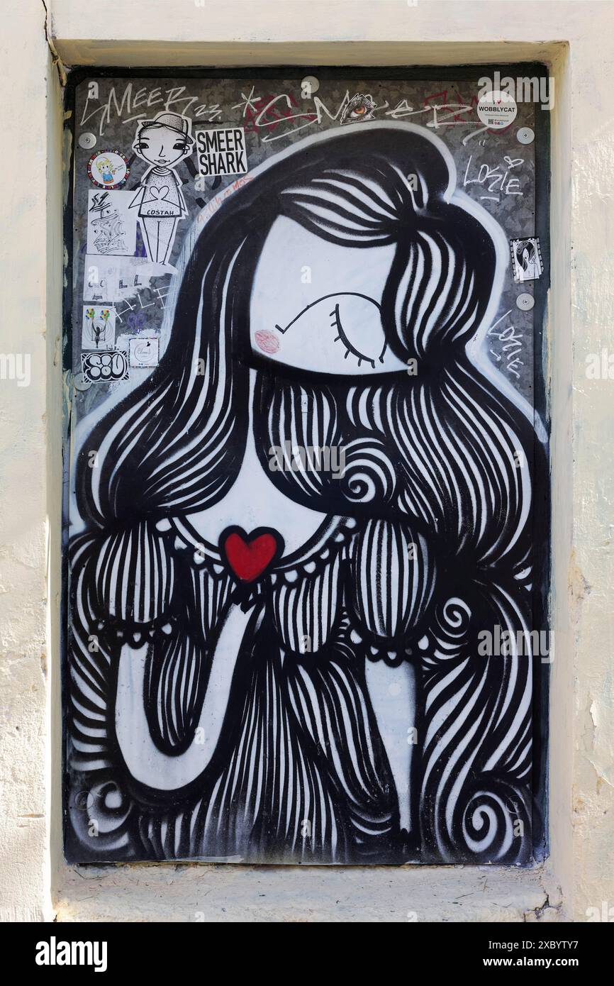 Female figure with red heart, graffiti by Greek street artist Sonke ...