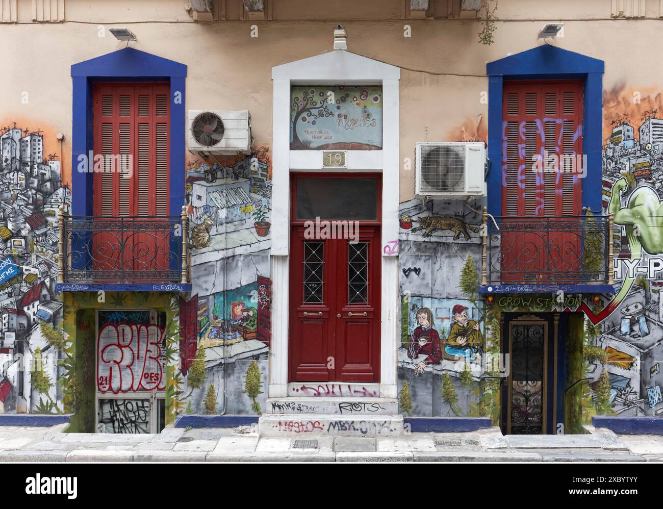 Painted facade of an old residential building in Exarchia, student and ...