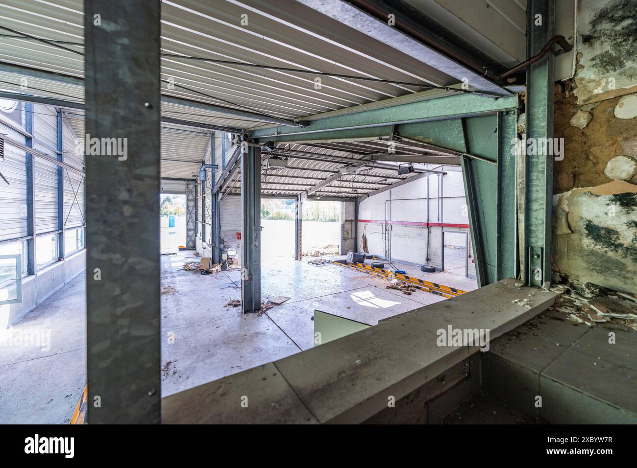 Large interior of a commercial hall with lots of light and a metal ...