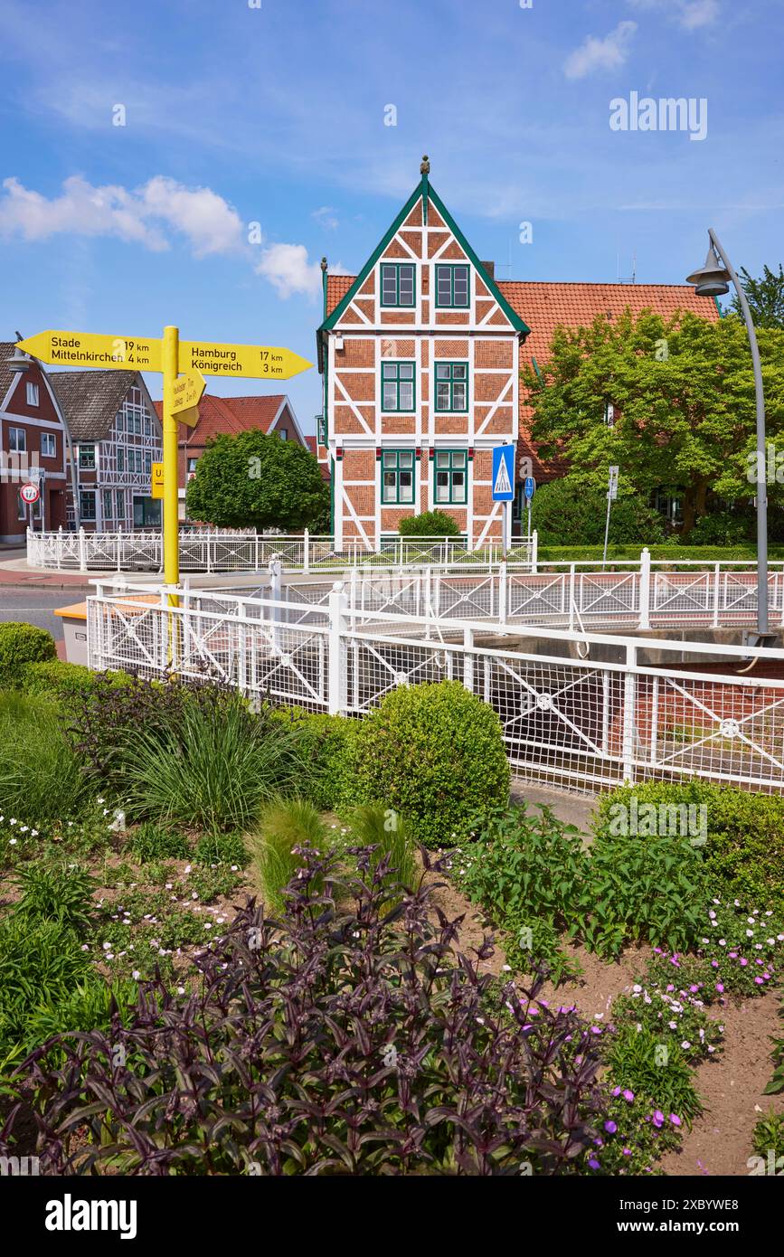 Town hall, signpost and flower bed in Jork, Altes Land, district of ...