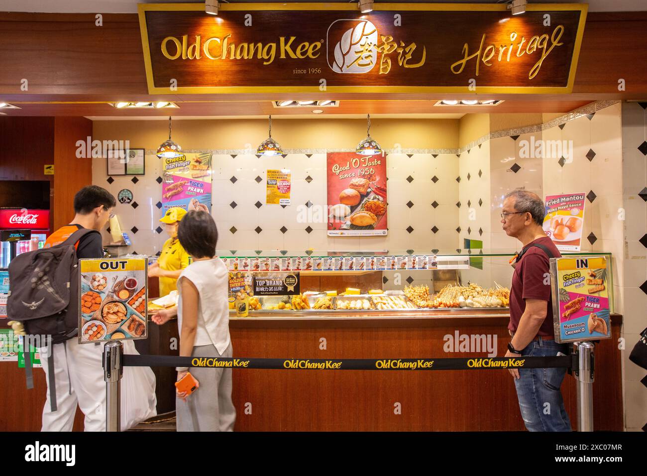 People queuing. Old Chang Kee outlet at Bugis Junction mall, one of the ... People queuing. Old Chang Kee outlet at Bugis Junction mall, one of the ...