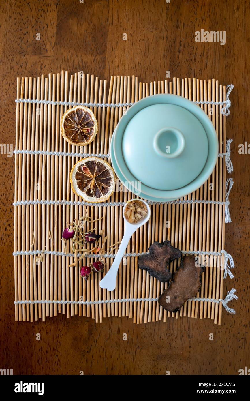 Ceramic cups and Chinese herbal decoction pieces Stock Photo - Alamy