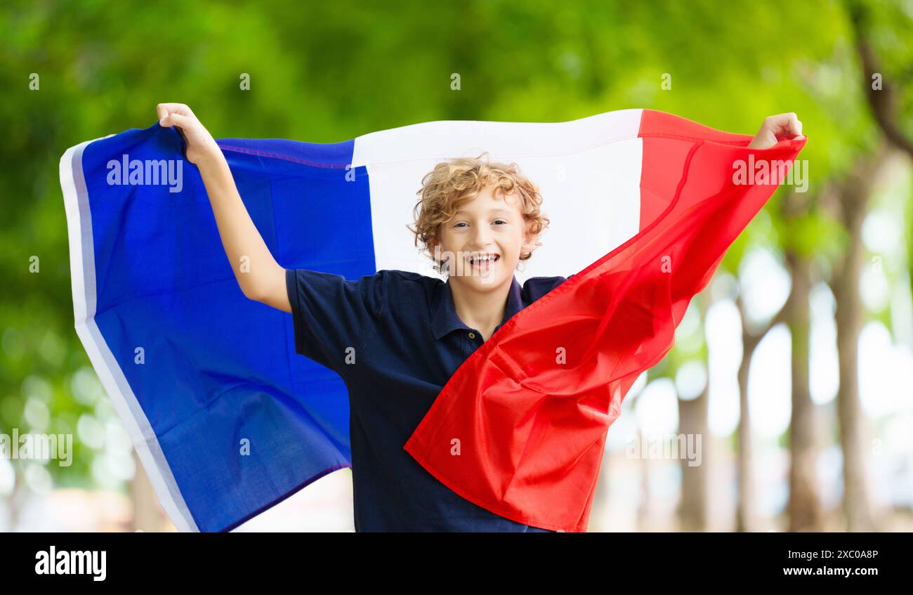 Child with running French flag. Kid cheering for France. French sports ...