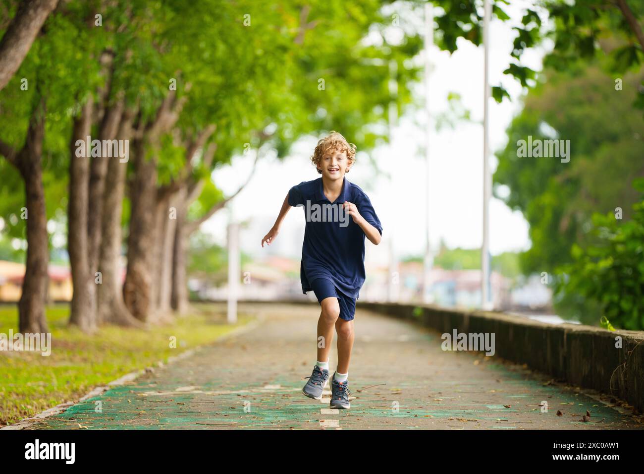 Kids run in summer park. Active child running. Sport for children ...