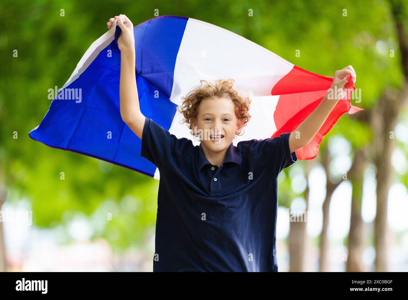 Child with running French flag. Kid cheering for France. French sports ...
