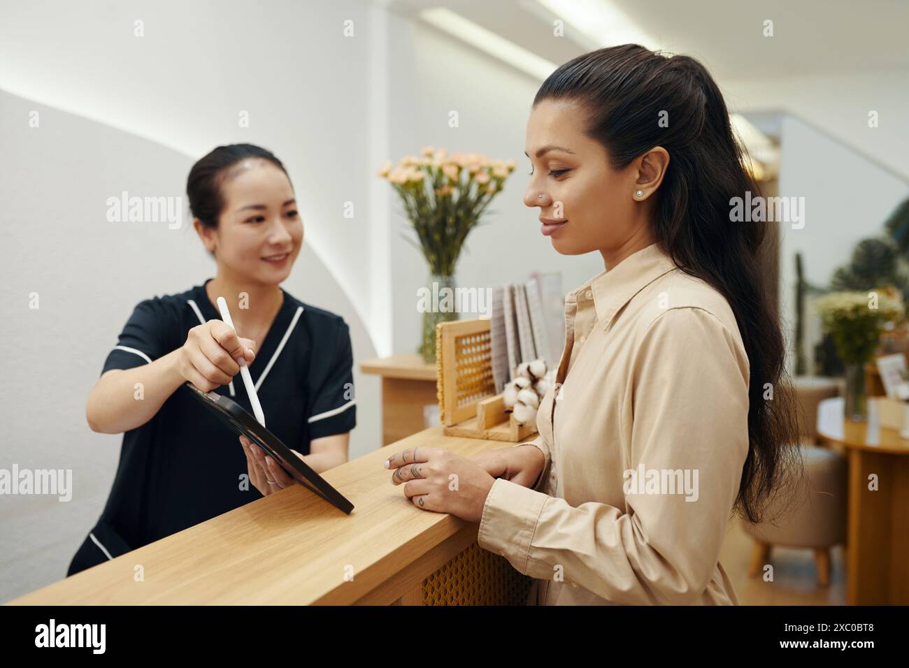 Salon receptionist phone hi-res stock photography and images - Alamy