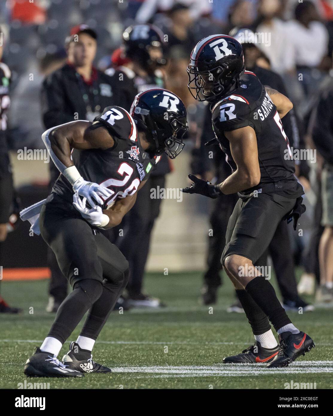 Ottawa, Canada. 13 Jun 2024. Frankie Griffin (28) of the Ottawa Redblacks and Jovan Santos-Knox ...