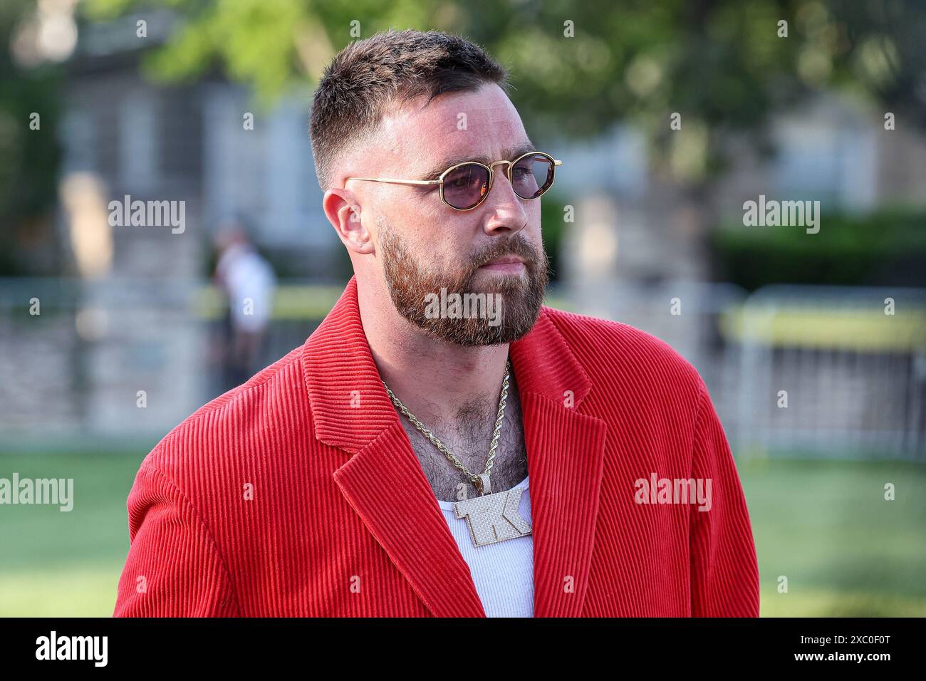 June 13, 2024: Travis Kelce walks behind the red carpet at the Kansas ...