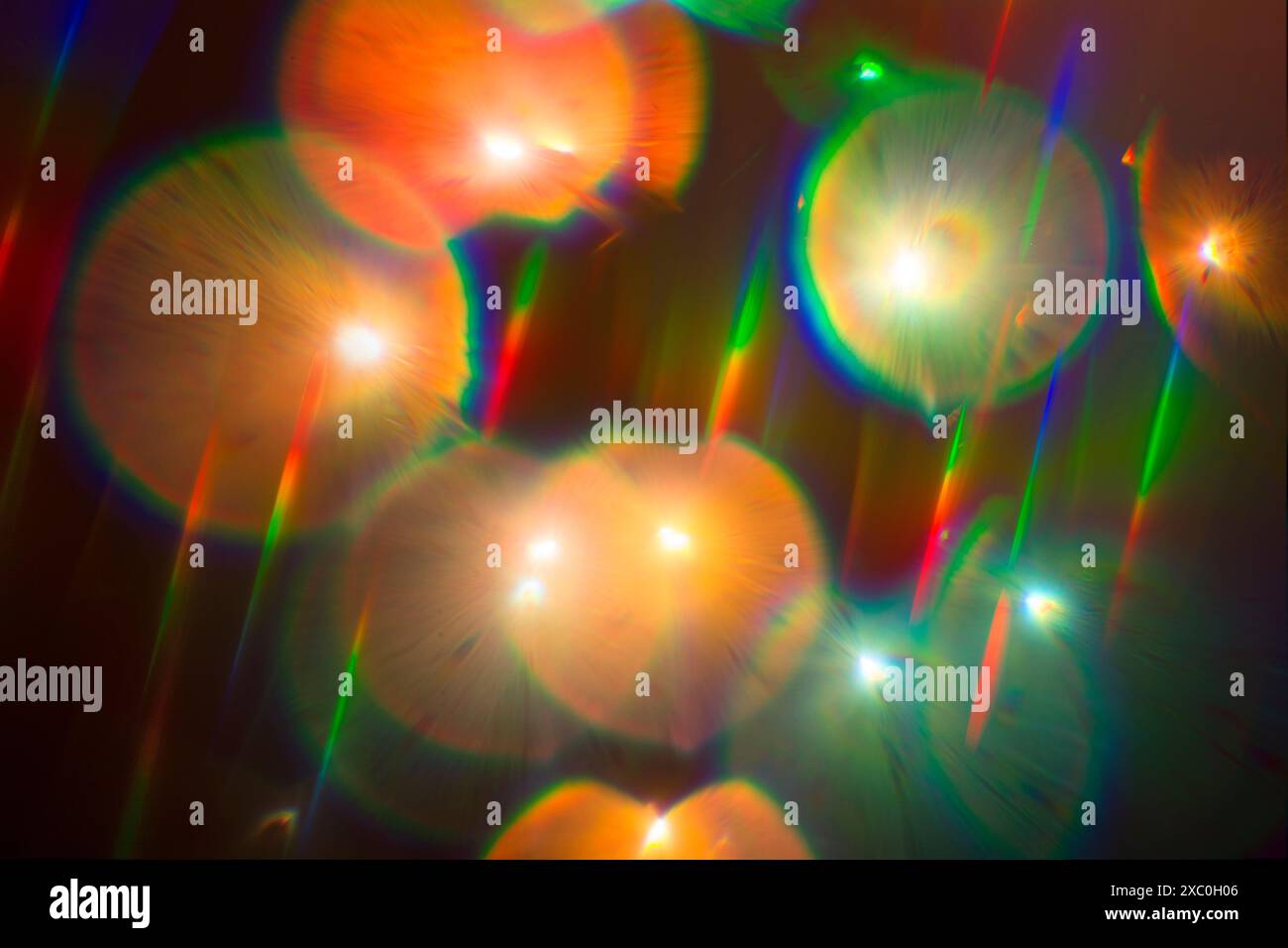 Out of focus Christmas lights, colourful with flare and rainbow colours ...