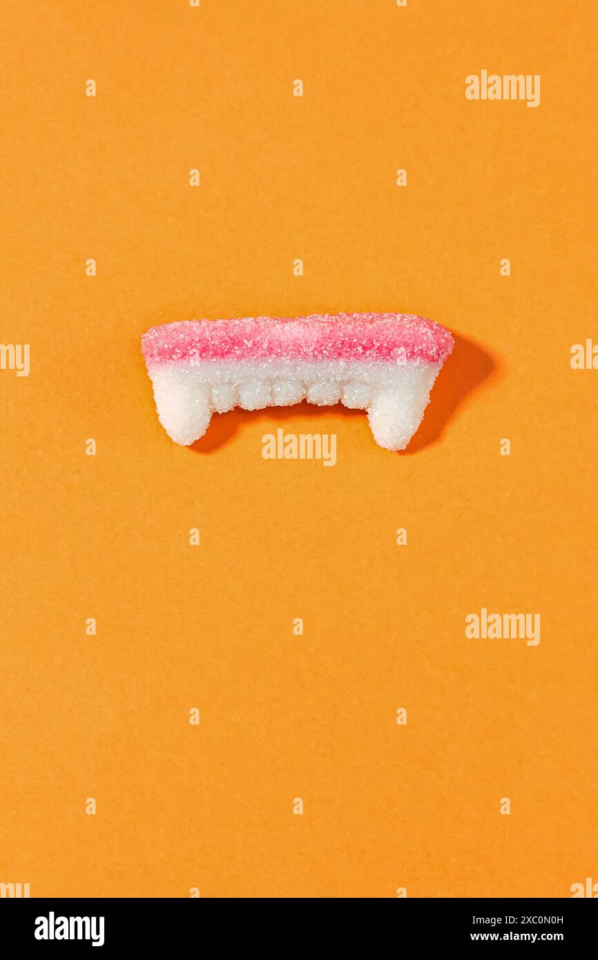 Gummy vampire teeth candy isolated on orange background, Halloween ...